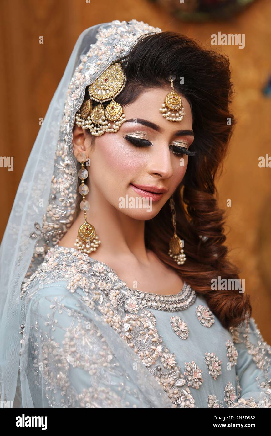 Pakistani. Indian Beautiful bride makeup for saloon shoot Stock Photo ...