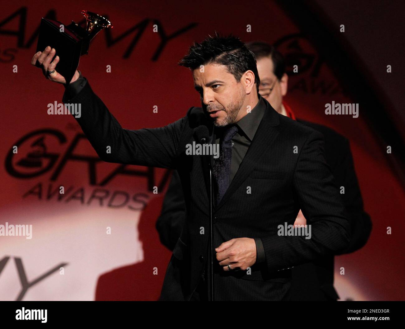 Luis Enrique accepts the award for best tropical latin album for ...