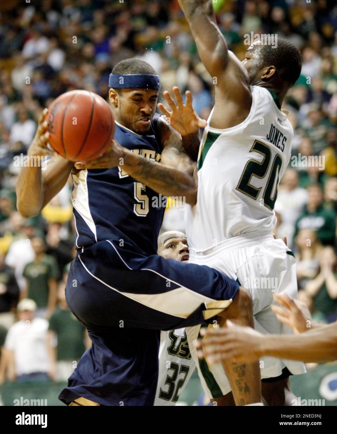 Pittsburgh's Gilbert Brown, left, tries to drive past South Florida's ...