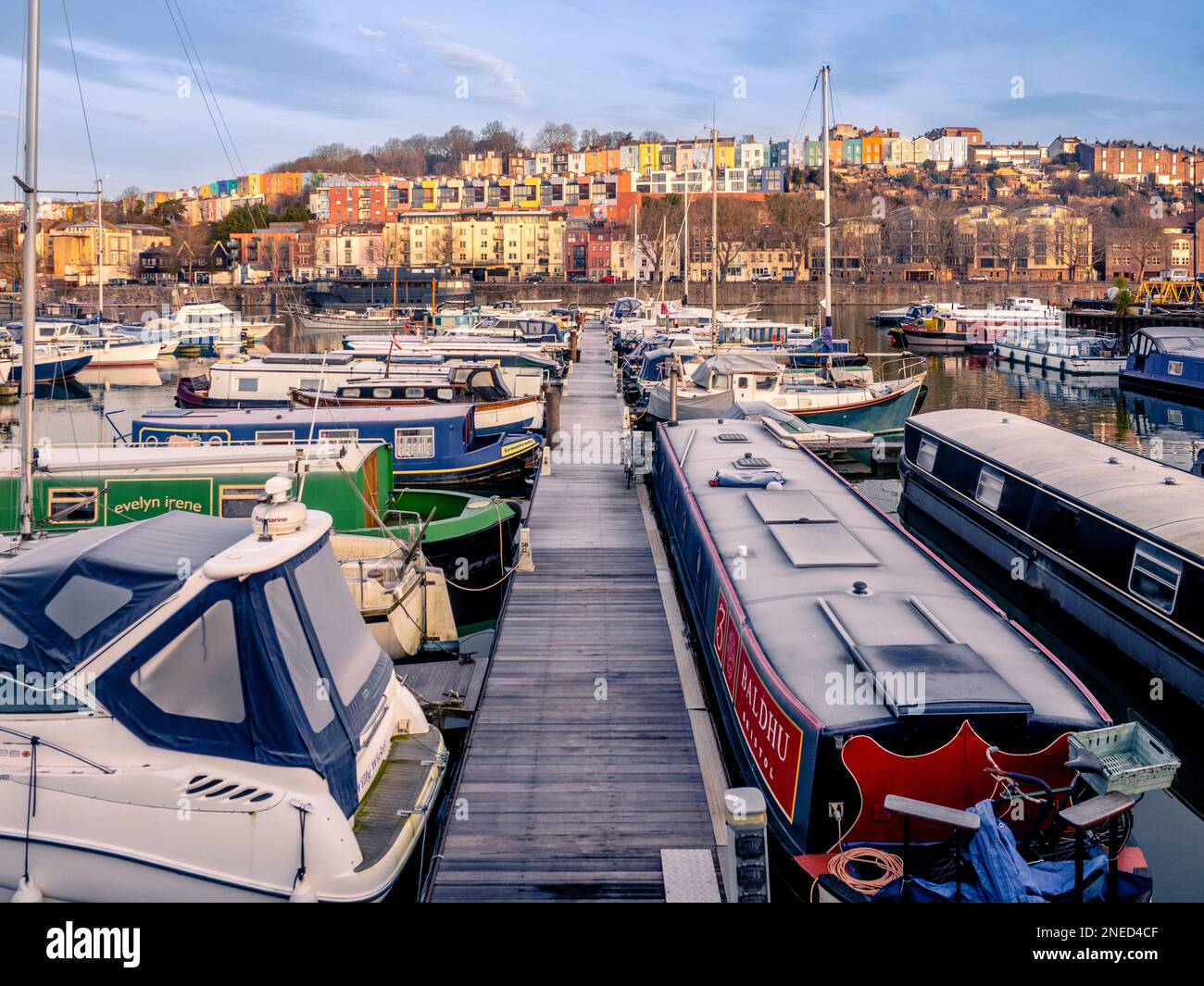 Looking down the frost covered wooden jetty of Bristol Marina towards ...