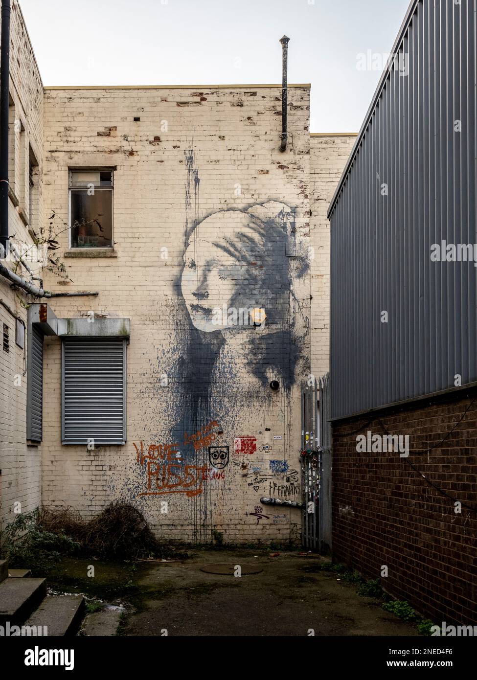 Banksy Bristol alleyway graffiti mural The Girl with the Pierced ...