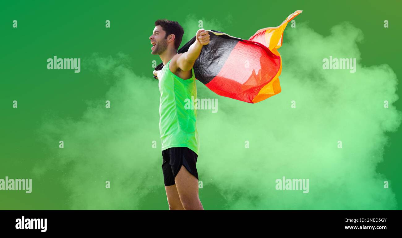 Composition of strong smiling caucasian male athlete holding german ...