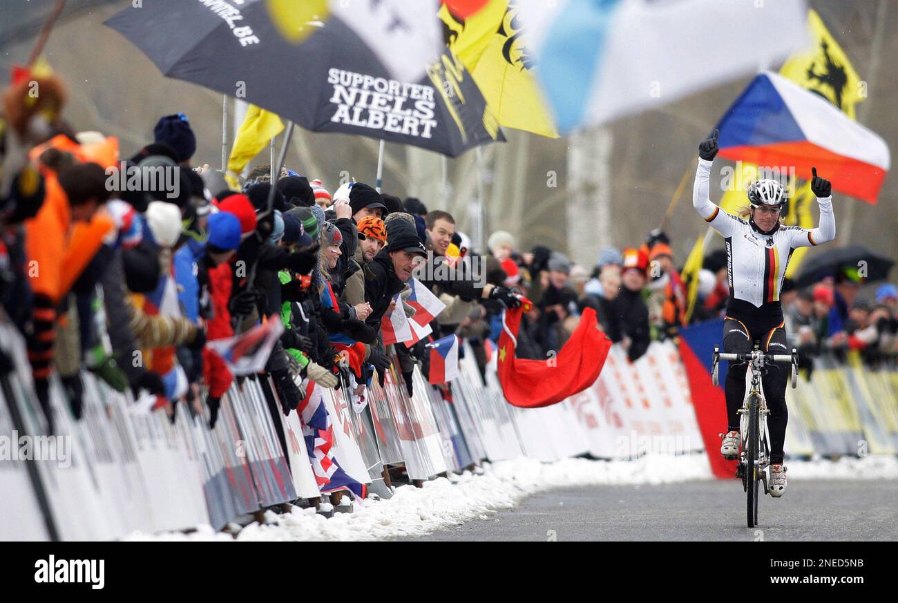 Hanka Kupfernagel from Germany reacts while crossing the finish line of ...