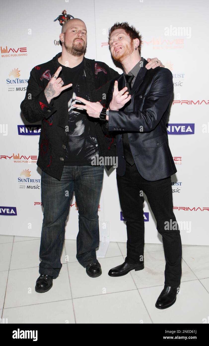 Musicians Scott Bartlett (L) and Jared Weeks (R) of Saving Abel attend ...