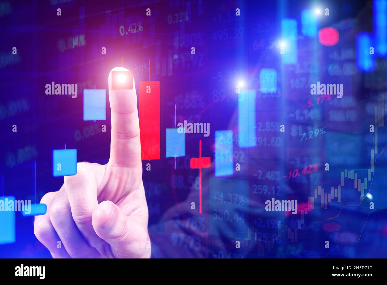 The trader points his finger at the stock chart on the monitor Stock ...