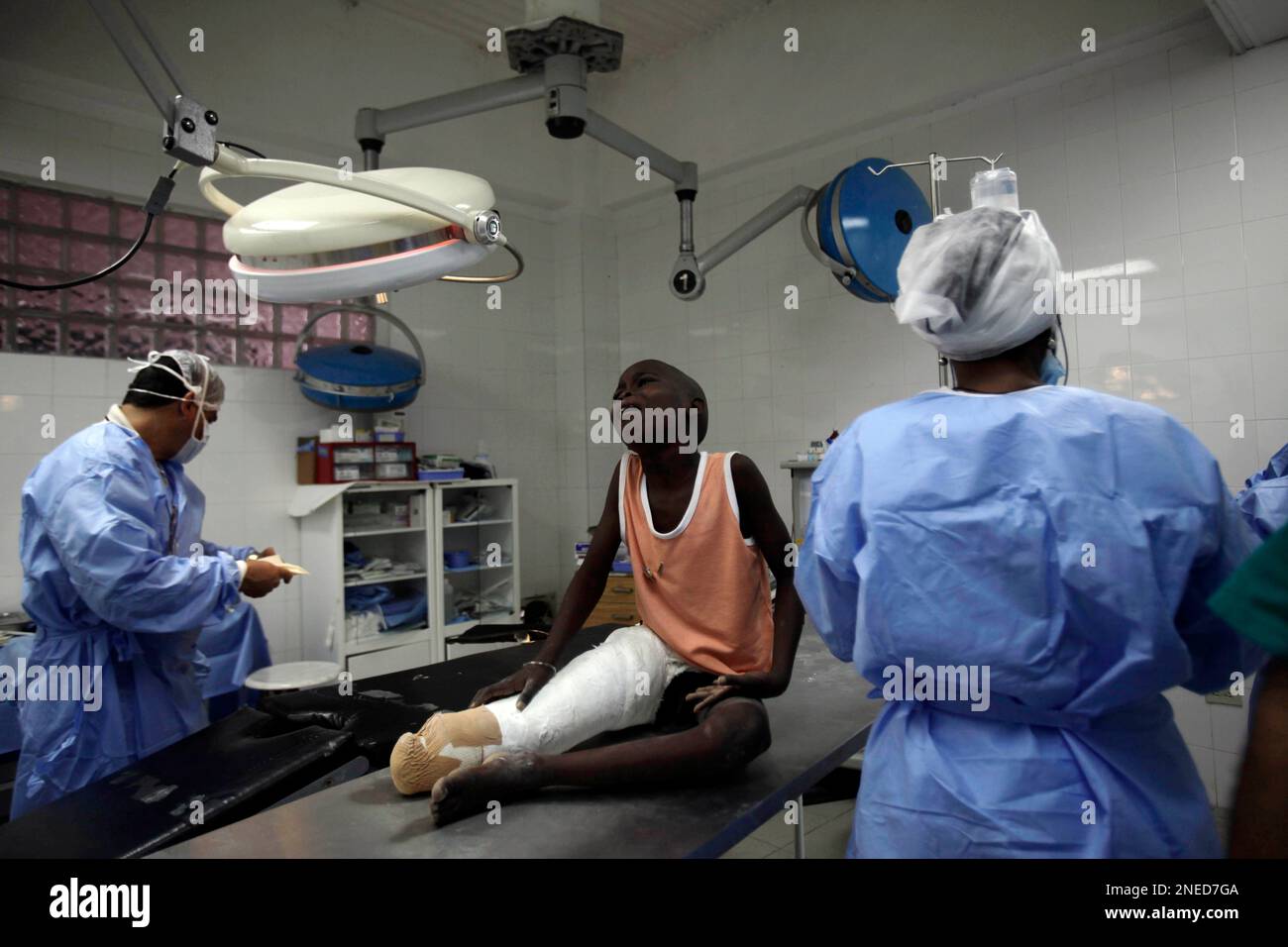 Robinson Jane, 8, cries as Cuban doctors prepare to replace the ...