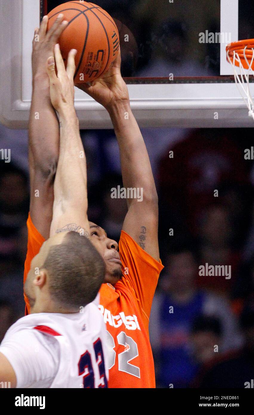 Syracuse's Kris Joseph (32) goes up for a shot against DePaul's Krys ...