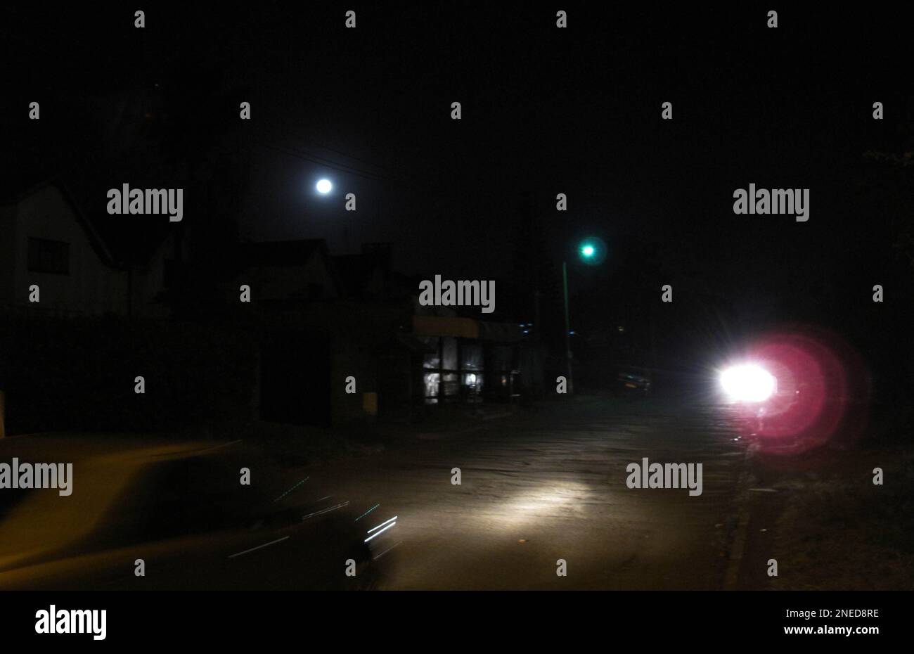 The moon , left, as seen in Nairobi, Kenya, Saturday, Jan. 30, 2010. On ...