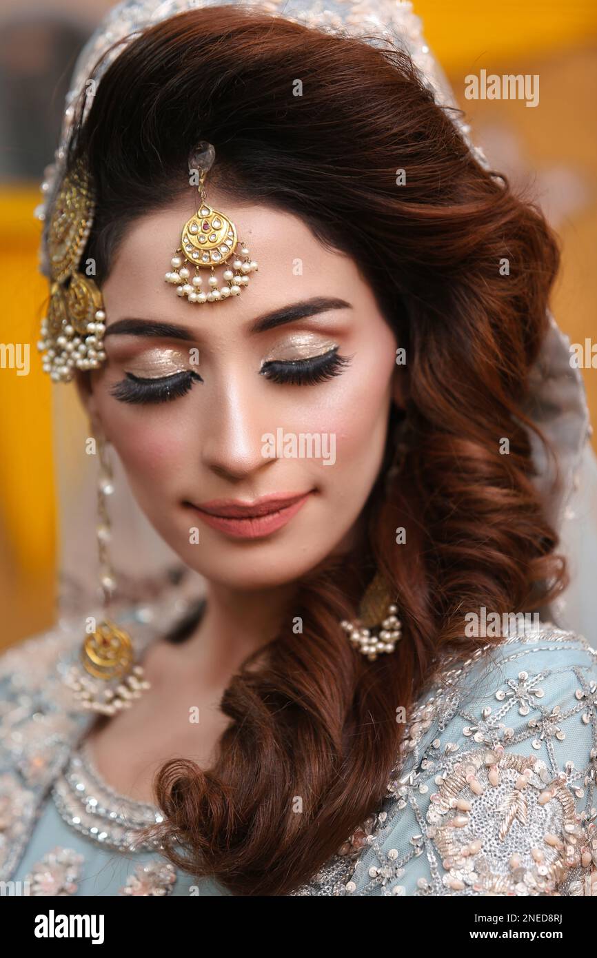 Pakistani. Indian Beautiful bride makeup for saloon shoot Stock Photo ...