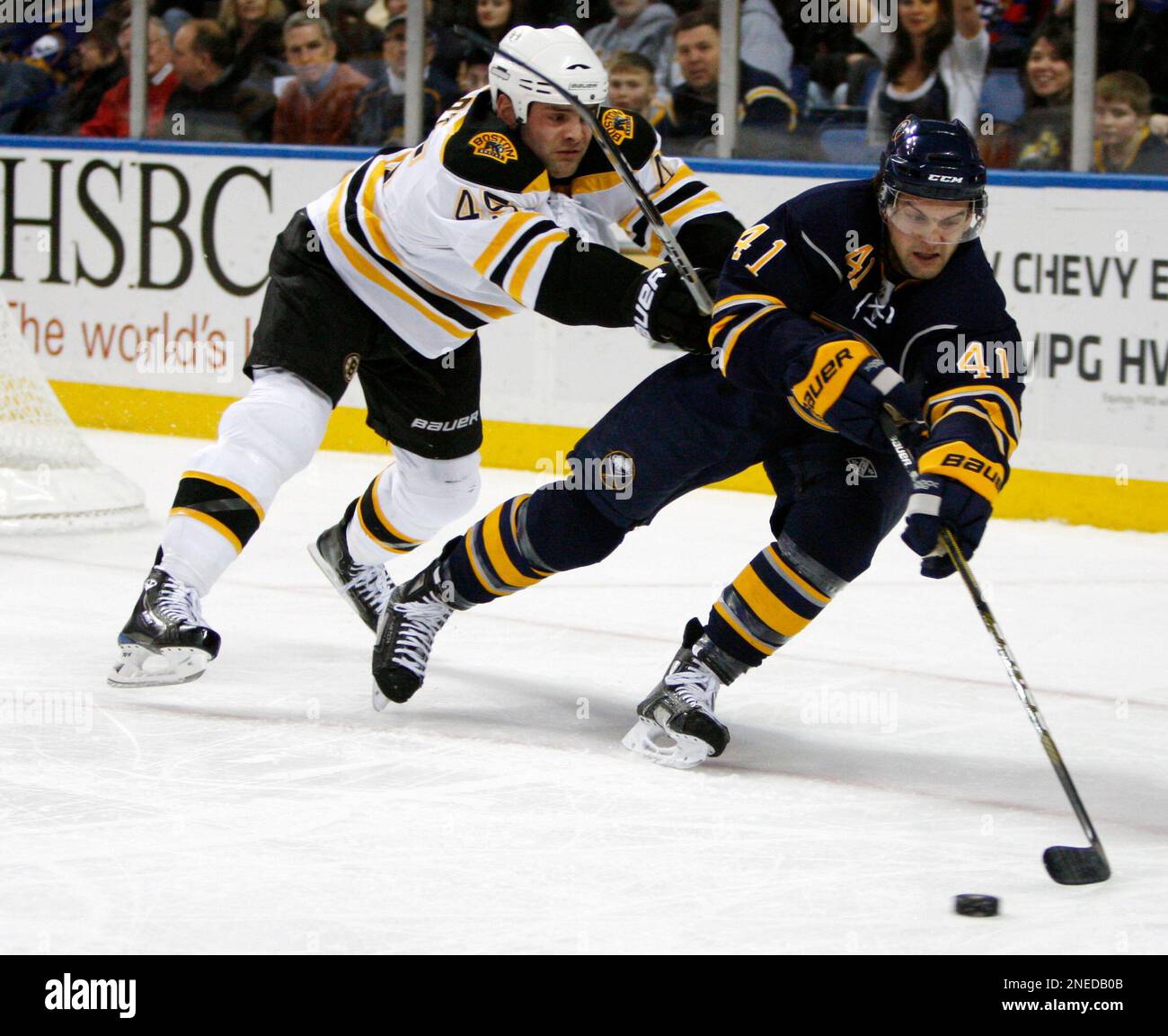 Buffalo Sabres' Clarke MacArthur (41) passes under pressure from Boston ...
