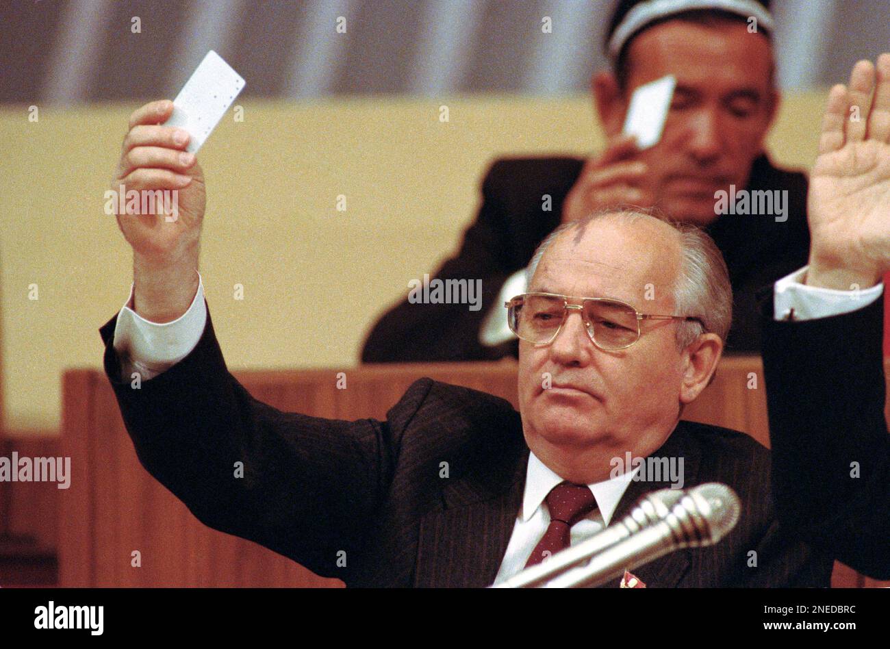 Soviet President Mikhail Gorbachev holds up his voting card during ...