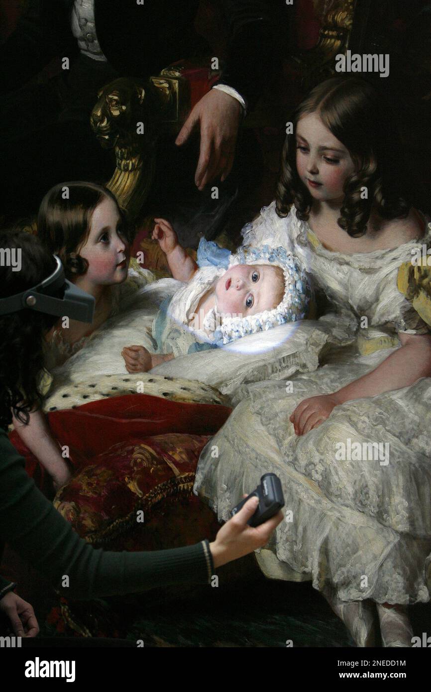 A member of staff examines the Franz Xaver Winterhalter painting, "The ...