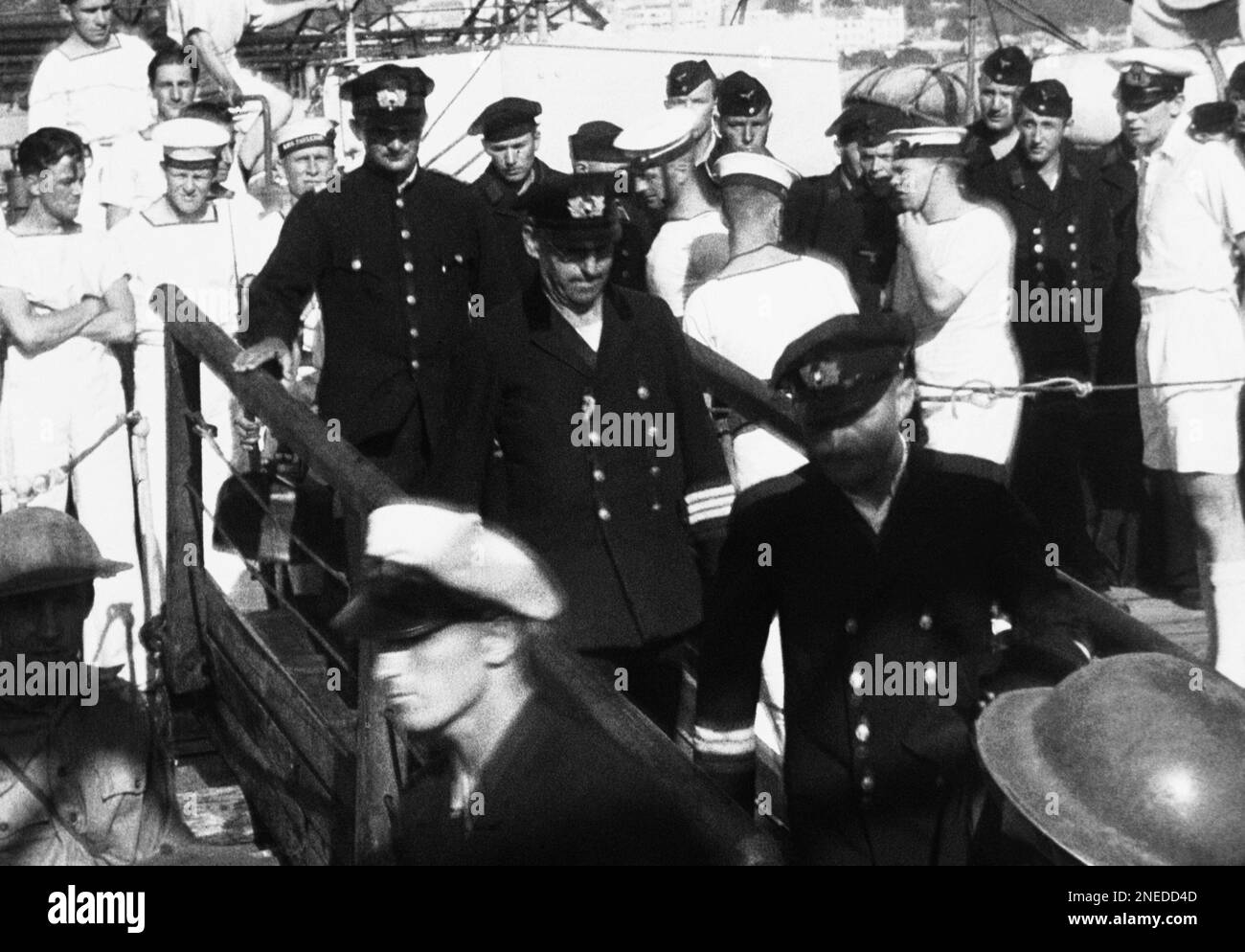 German prisoners, captured when an enemy sea raider was sunk, walking ...