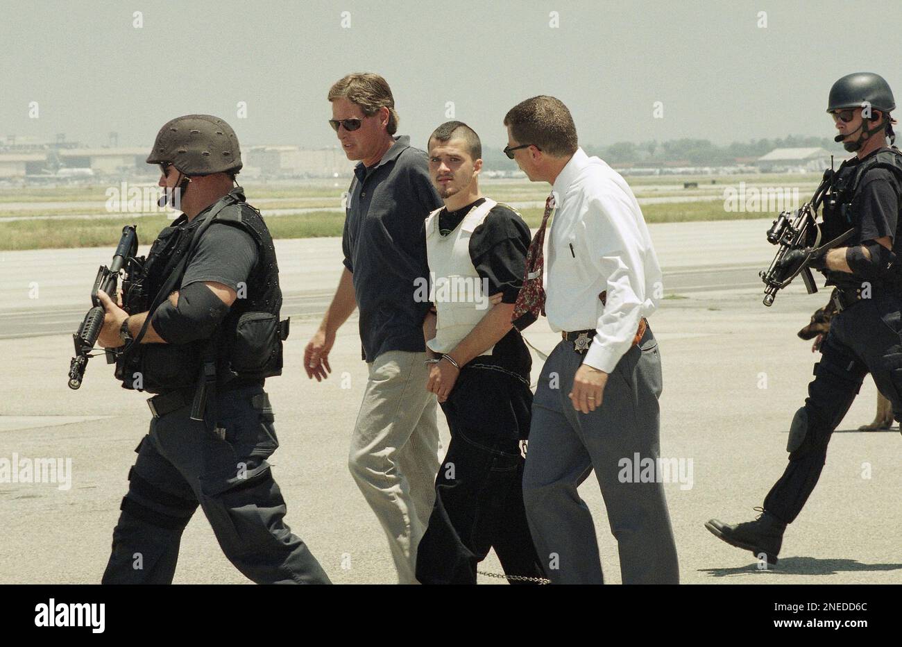 Jesse Fanus, second right, the 19-year-old suspect accused in the ...