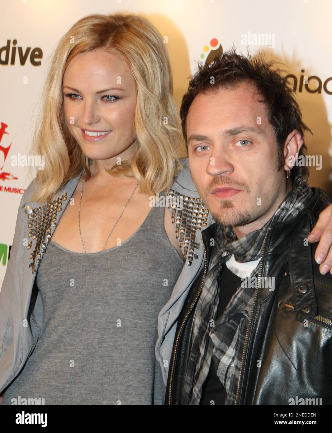 Malin Akerman, left, and Roberto Zincone arrive at will.i.am's Dipdive ...