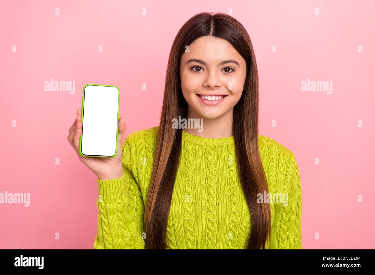 Photo portrait of cute young girl holding device white empty space ...
