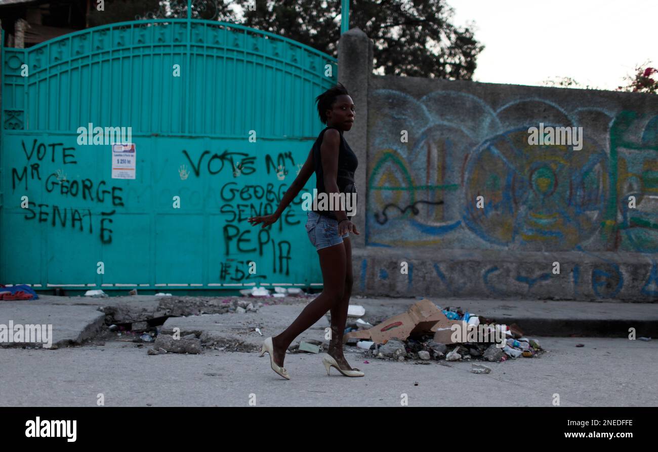 A woman walks in downtown Port-au-Prince, Thursday, Jan. 28, 2010. A 7. ...