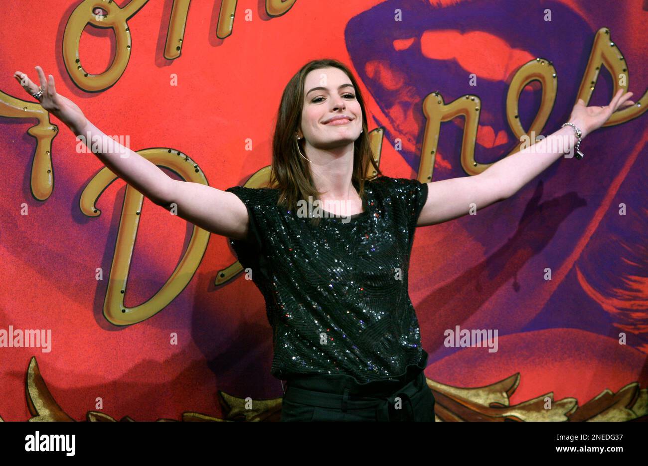 Actress Anne Hathaway reacts to the crowd as she is honored as Harvard ...