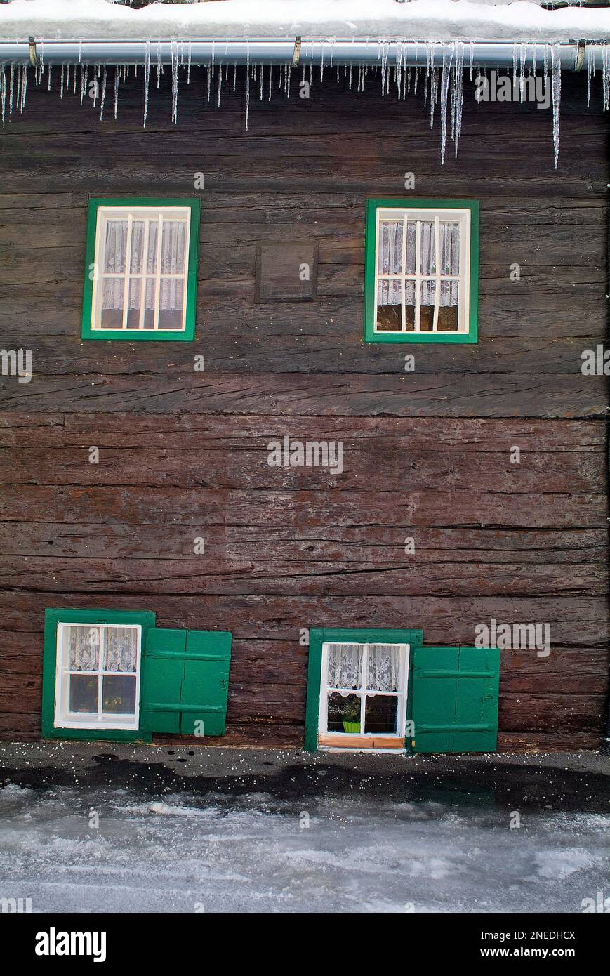 Austria, old house traditionally built of wood with small windows and ...