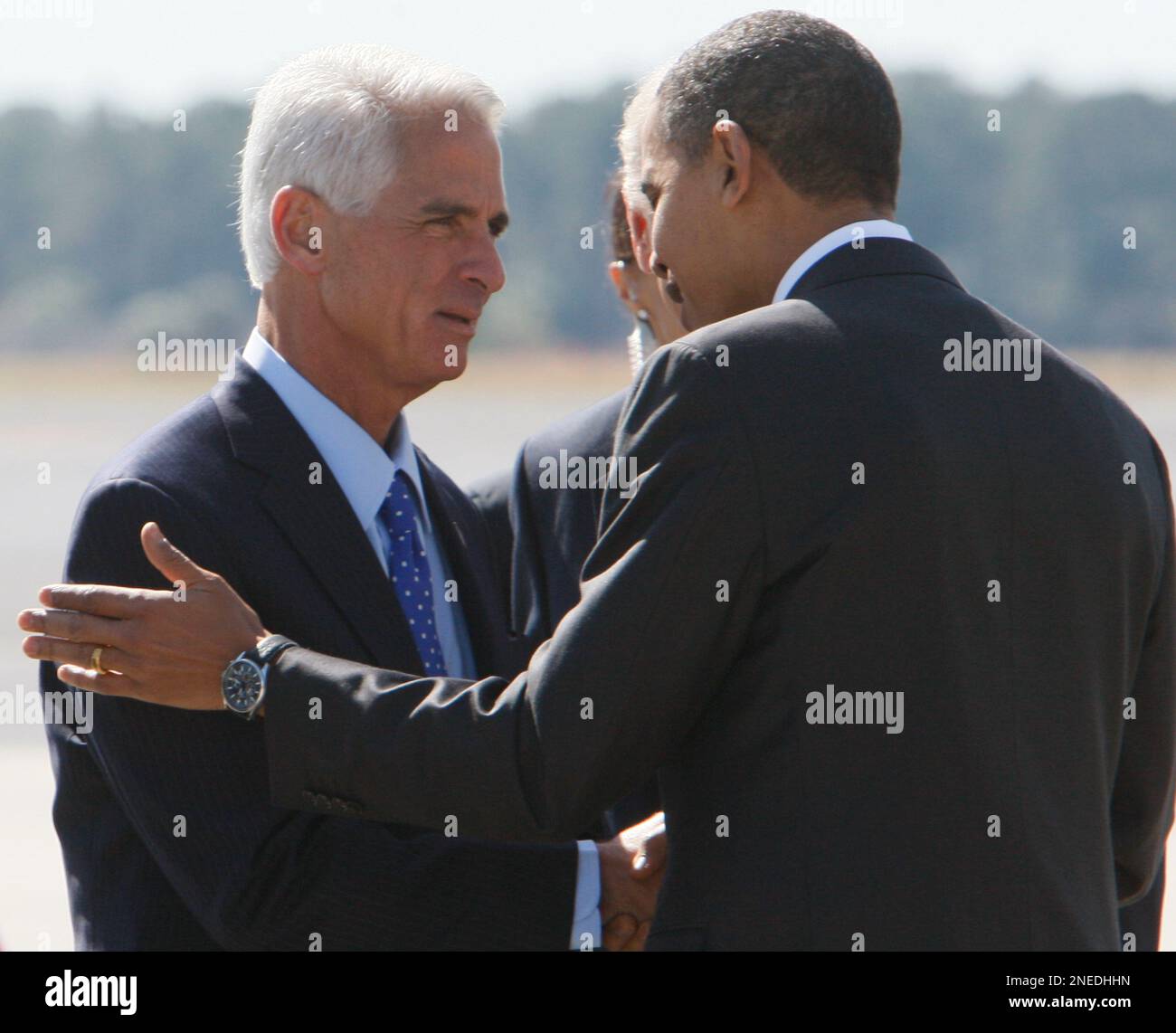 President Barack Obama is greeted by Florida Gov. Charlie Crist upon ...