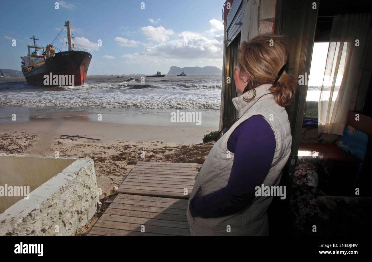 A woman looks from her home near the beach, at the Panamanian flagged ...