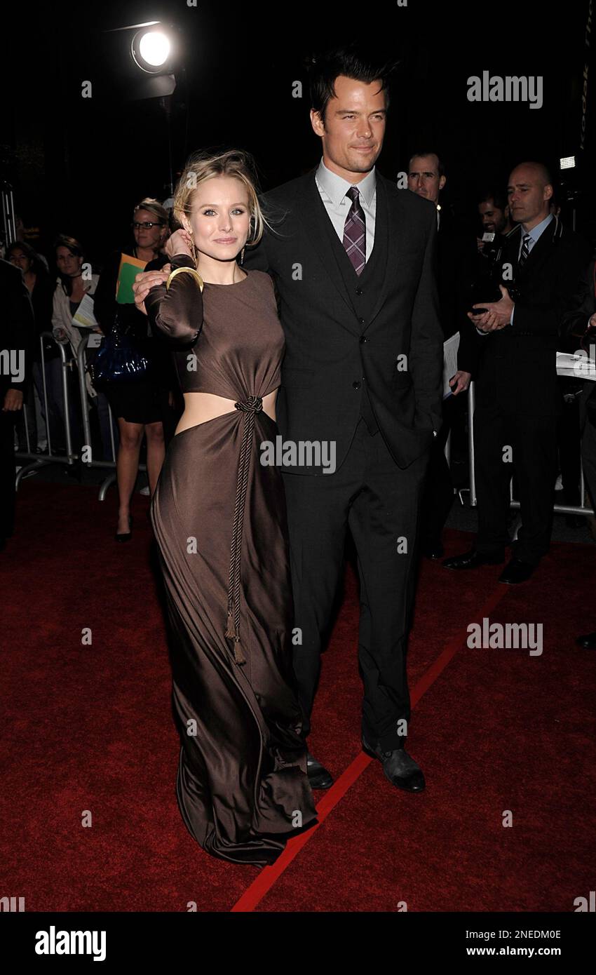 Actress Kristen Bell, left, and actor Josh Duhamel arrives at a ...