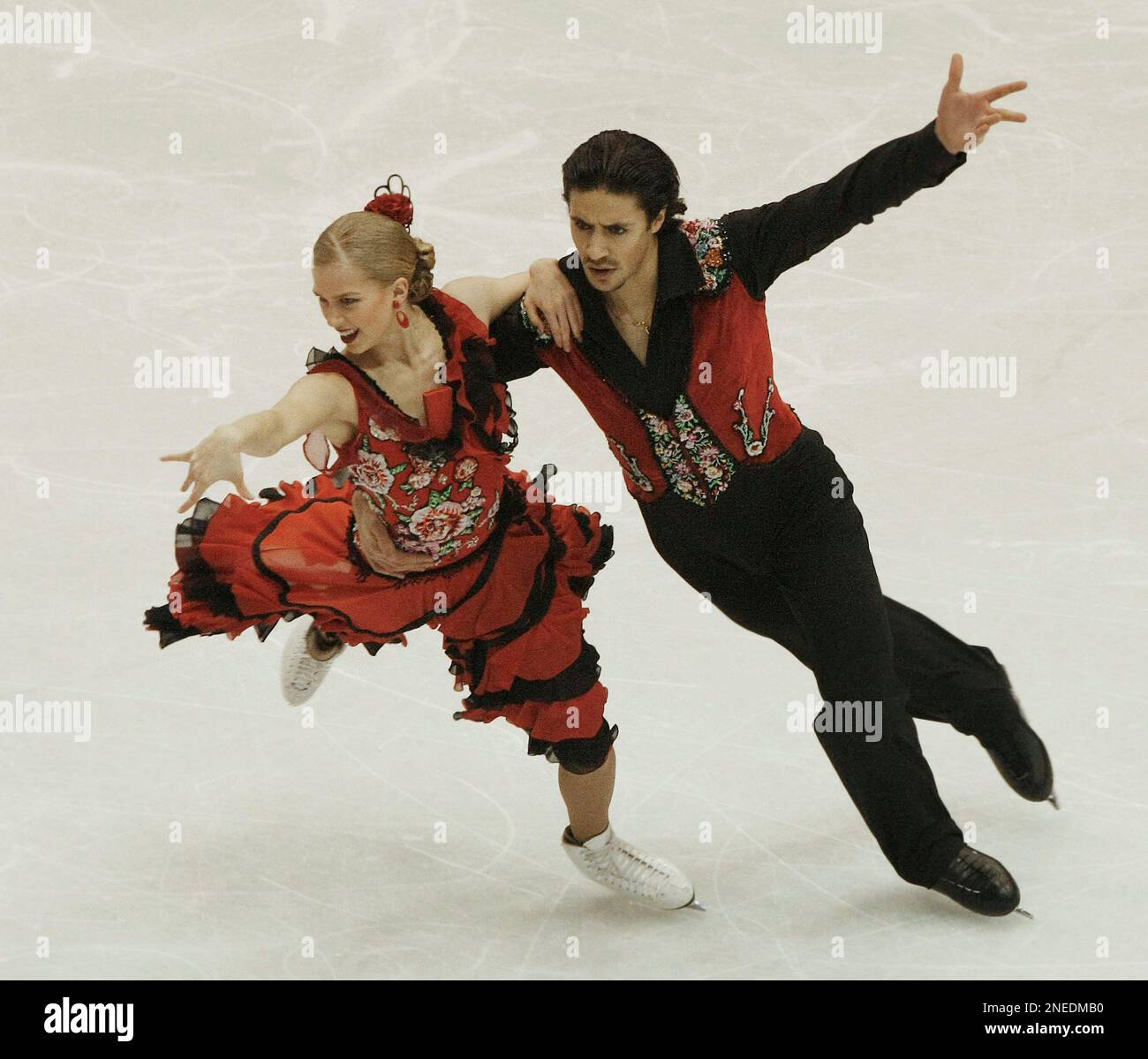 Canada's Andrew Poje and Kaitlyn Weaver, left, perform their ice dance ...