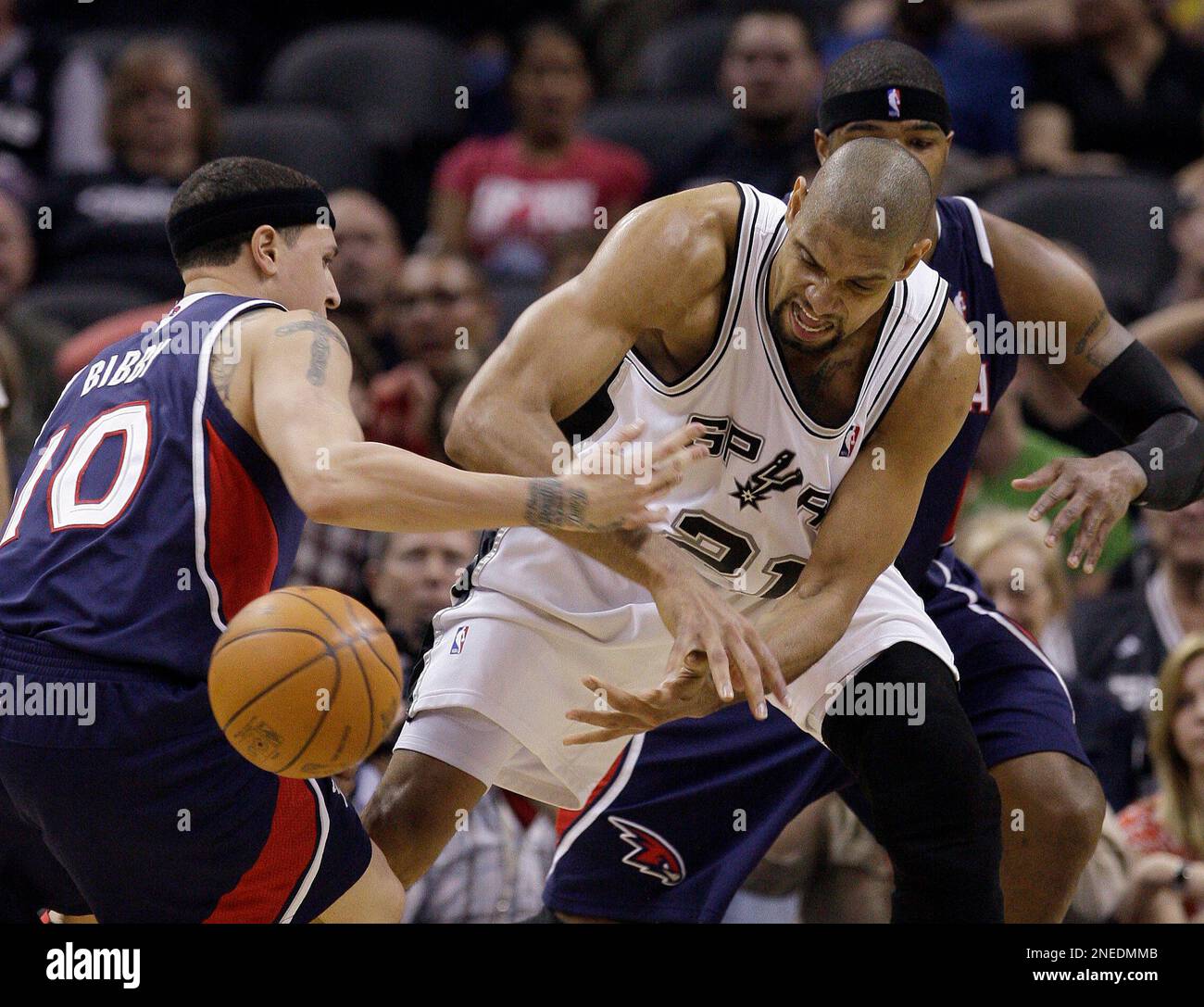 San Antonio Spurs' Tim Duncan, right, fights for control of the ball ...