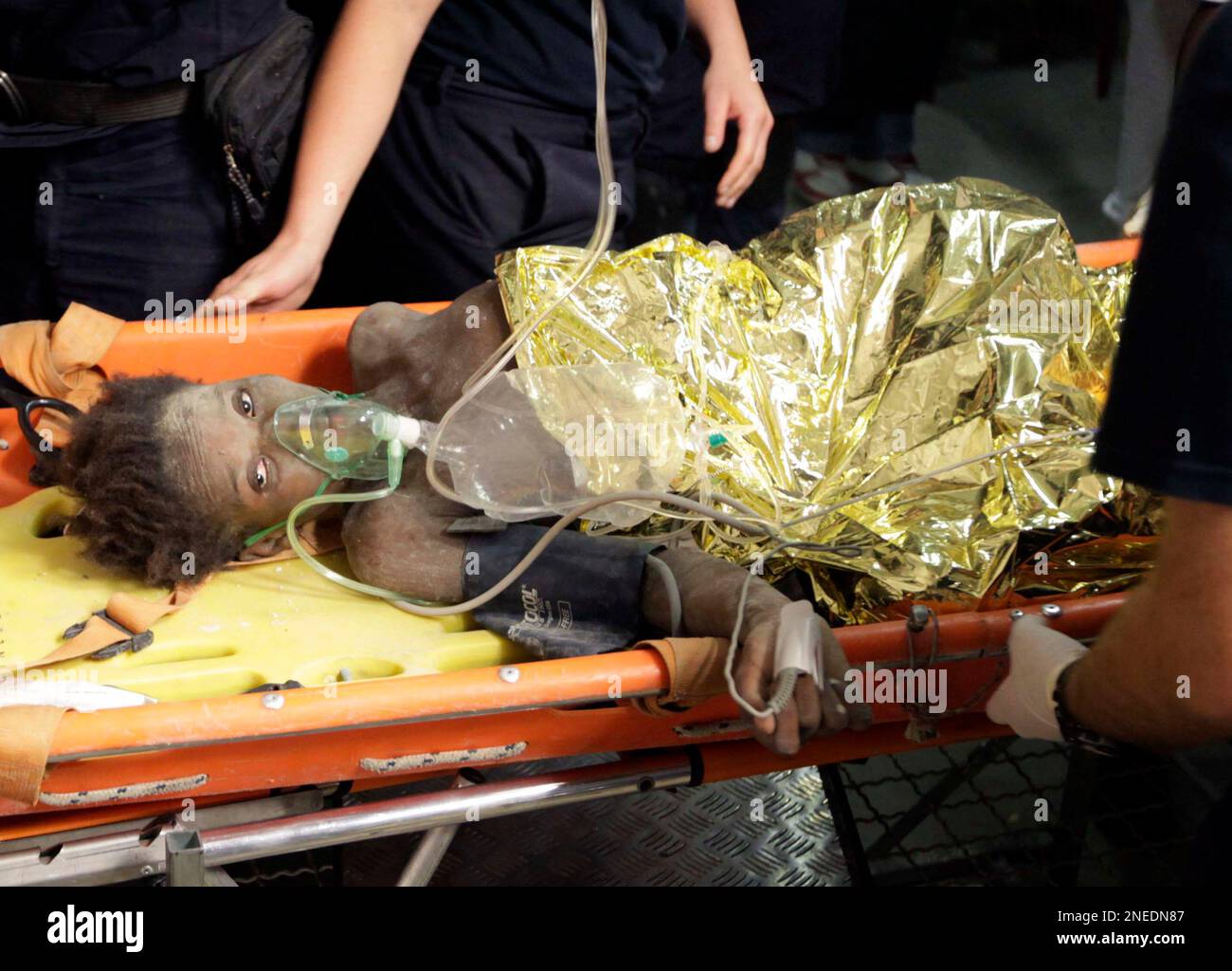 Darlene Etienne, 17, is treated at a French military field hospital ...