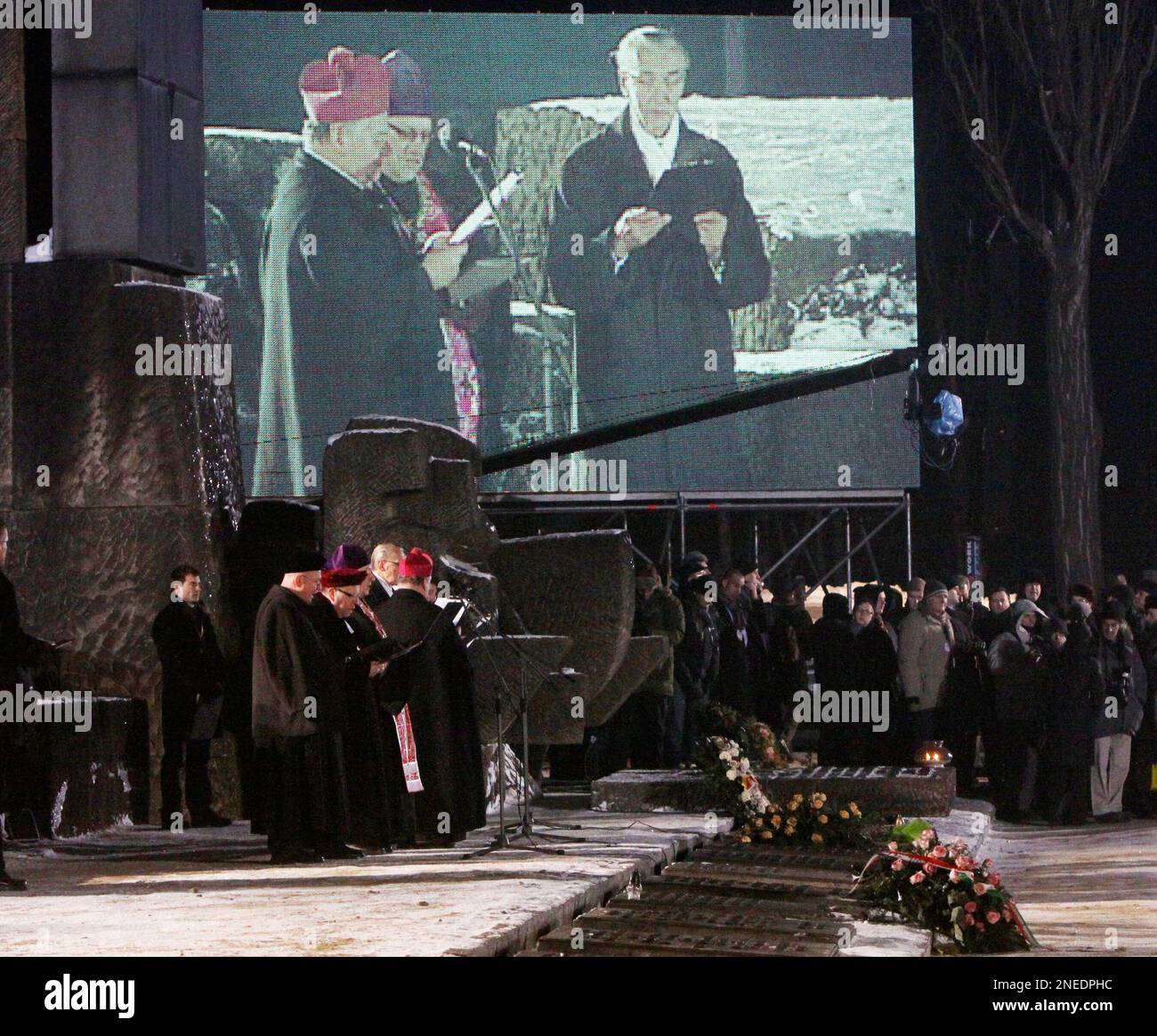 Priests lead prayers at the monument to the victims of the Nazi death ...