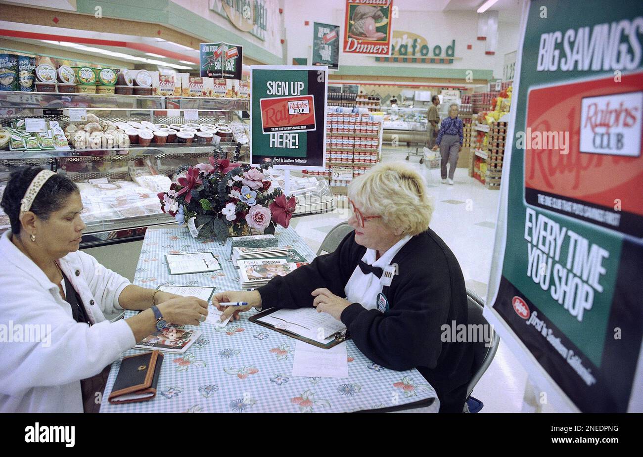 Rosario Dageett, left, originally from Colombia, signs up with the ...
