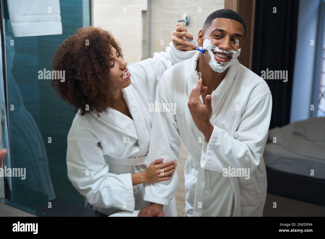 Woman shaving boyfriend face hi-res stock photography and images - Alamy