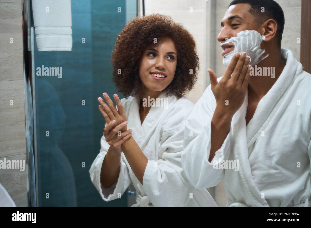 Cute young couple doing their morning routine in hotel bathroom Stock ...