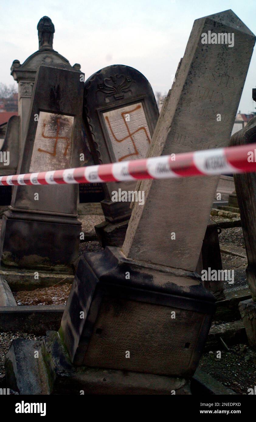 Desecrated graves are seen in the main Jewish cemetery of Strasbourg ...