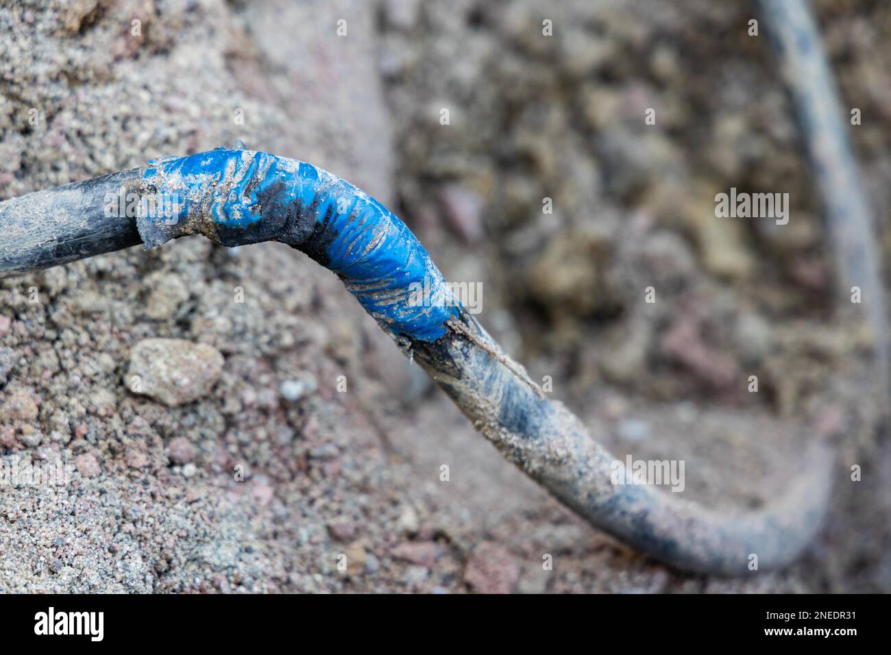 Improper repair of cable after excavator damage Stock Photo - Alamy