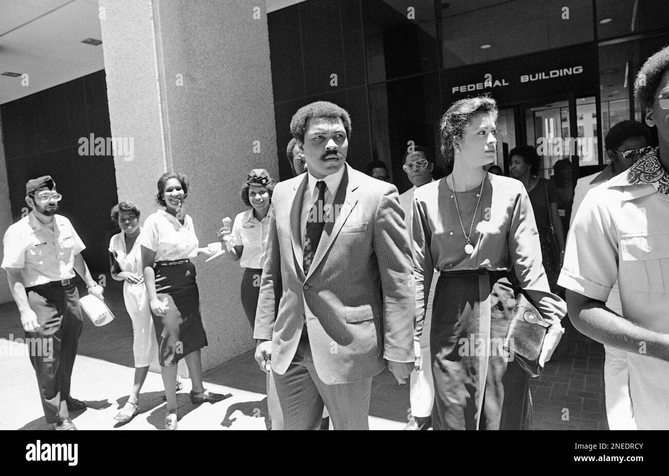 Former heavyweight champ Muhammad Ali and his wife Veronica hold hands ...