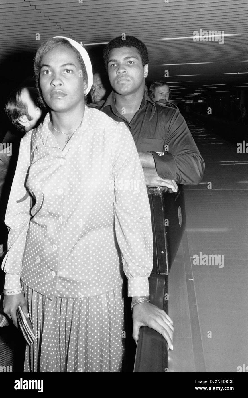 World heavyweight champion Muhammad Ali is preceded by his wife Belinda ...