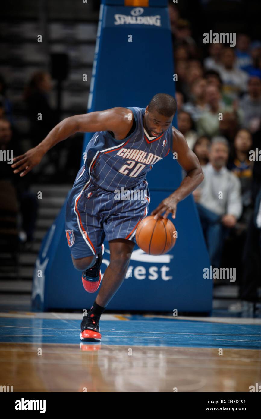 Charlotte Bobcats guard Raymond Felton picks up a loose ball while ...