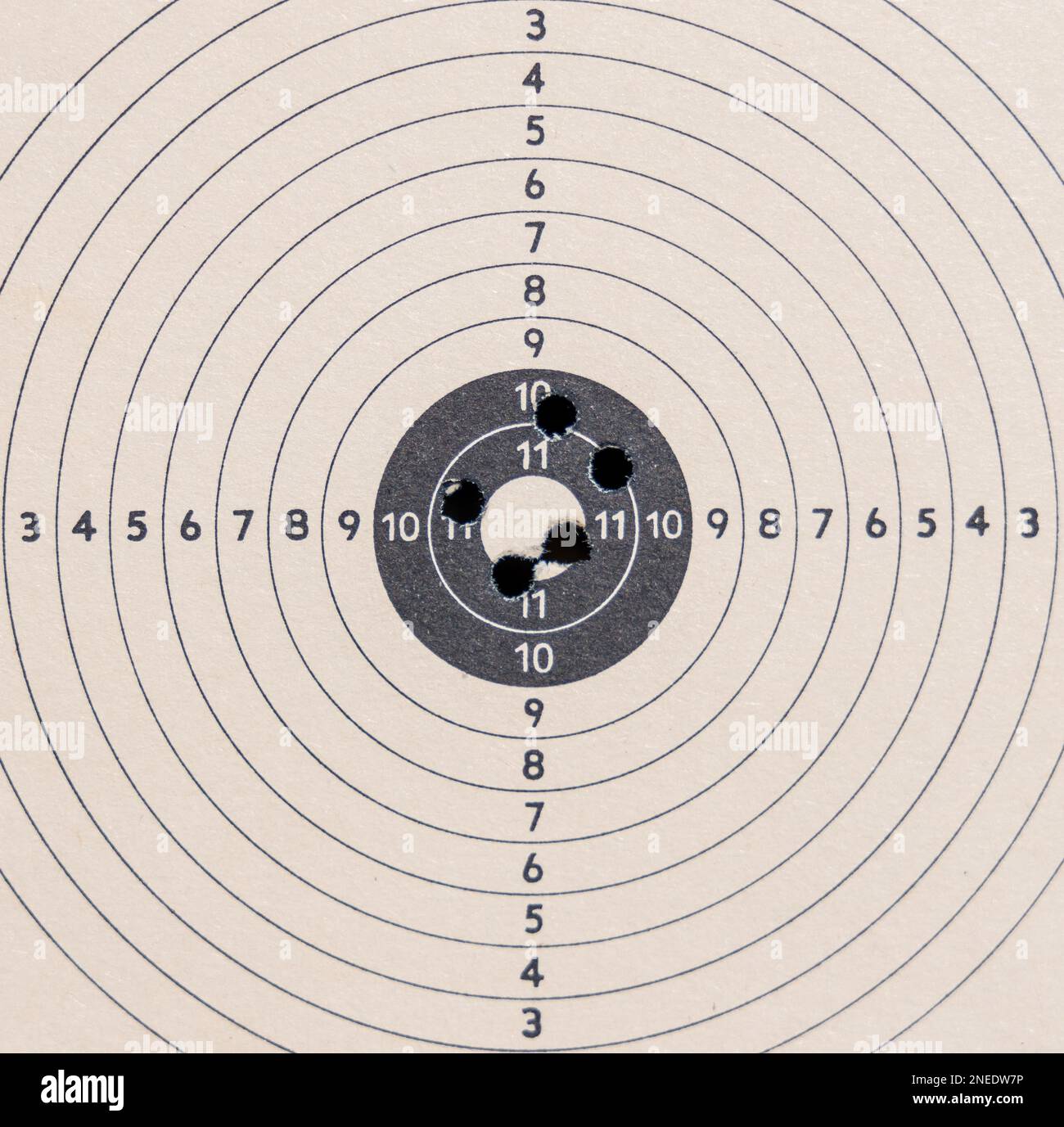 Air rifle target hit pattern Stock Photo - Alamy