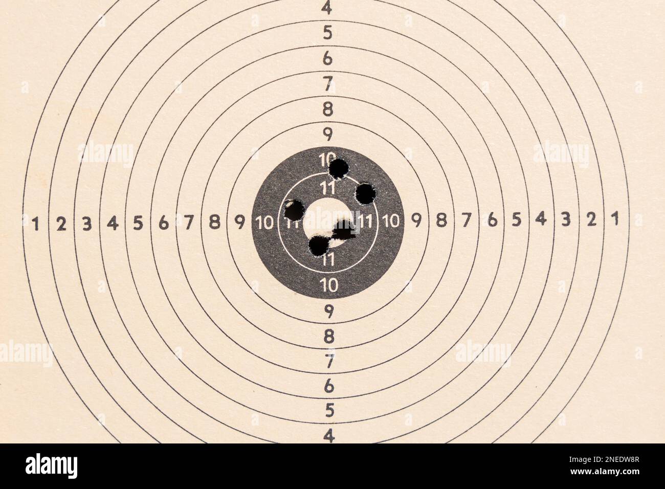 Air rifle target hit pattern Stock Photo - Alamy