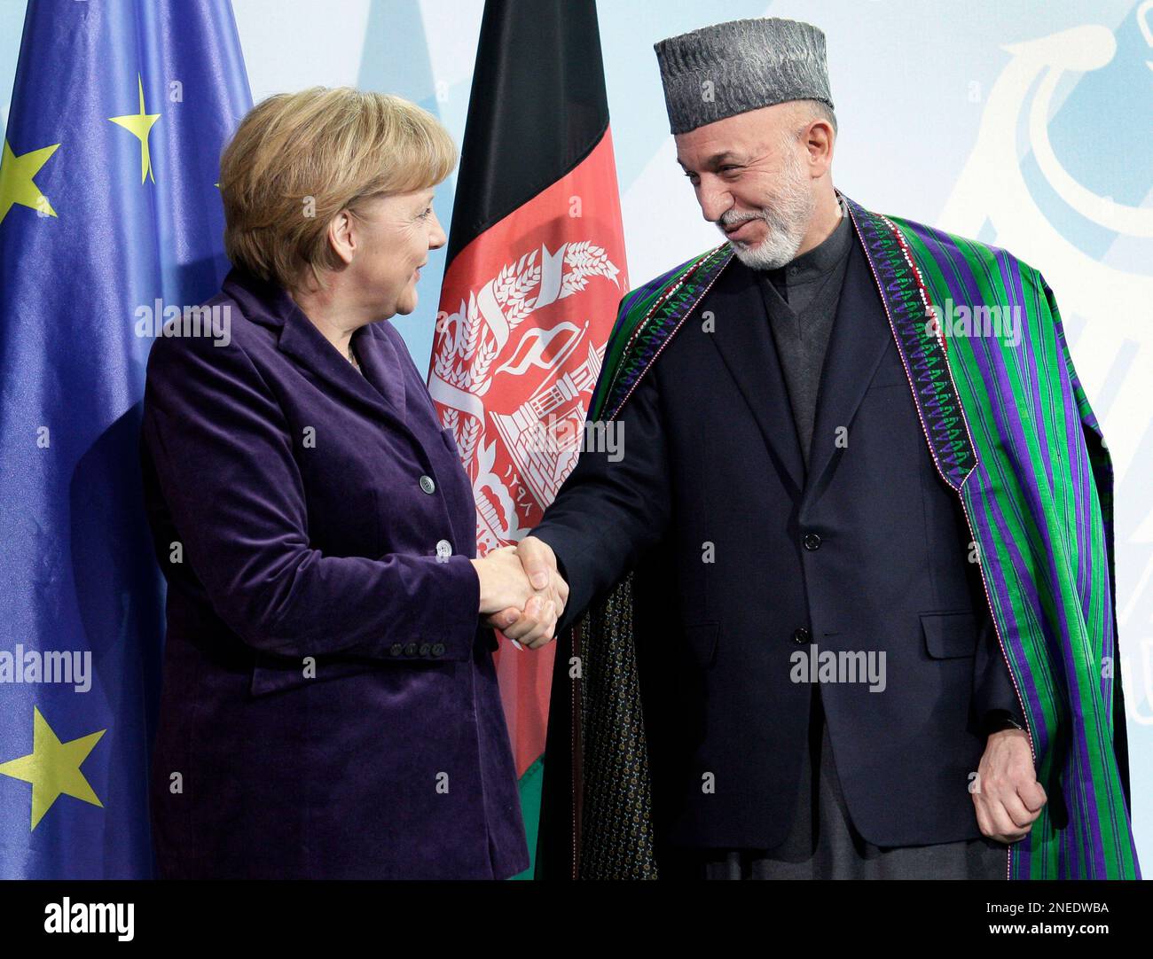 German Chancellor Angela Merkel, left, and the President of Afghanistan ...
