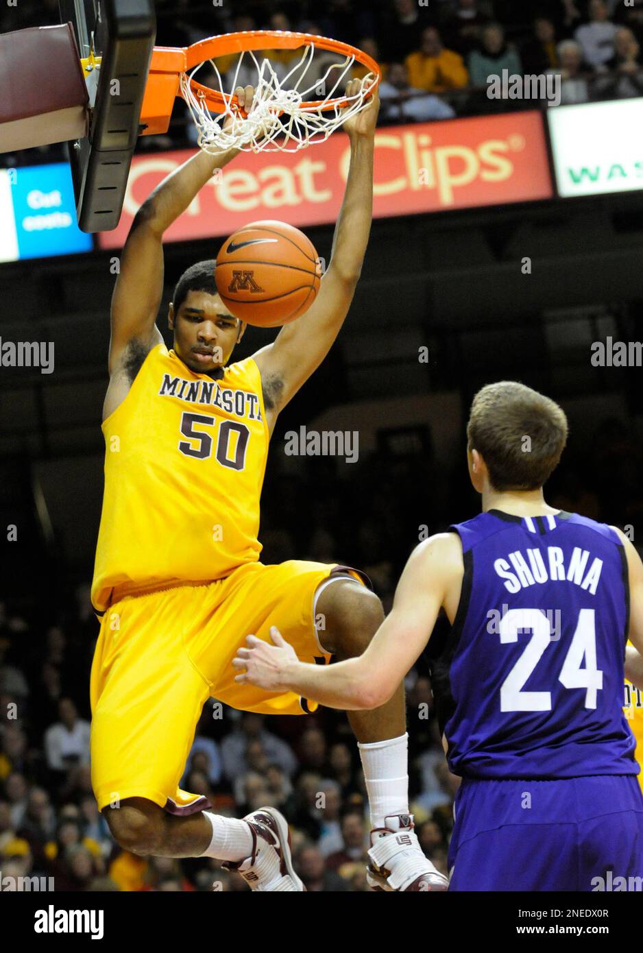 Minnesota's Ralph Sampson III, left, dunks in front of Northwestern's ...