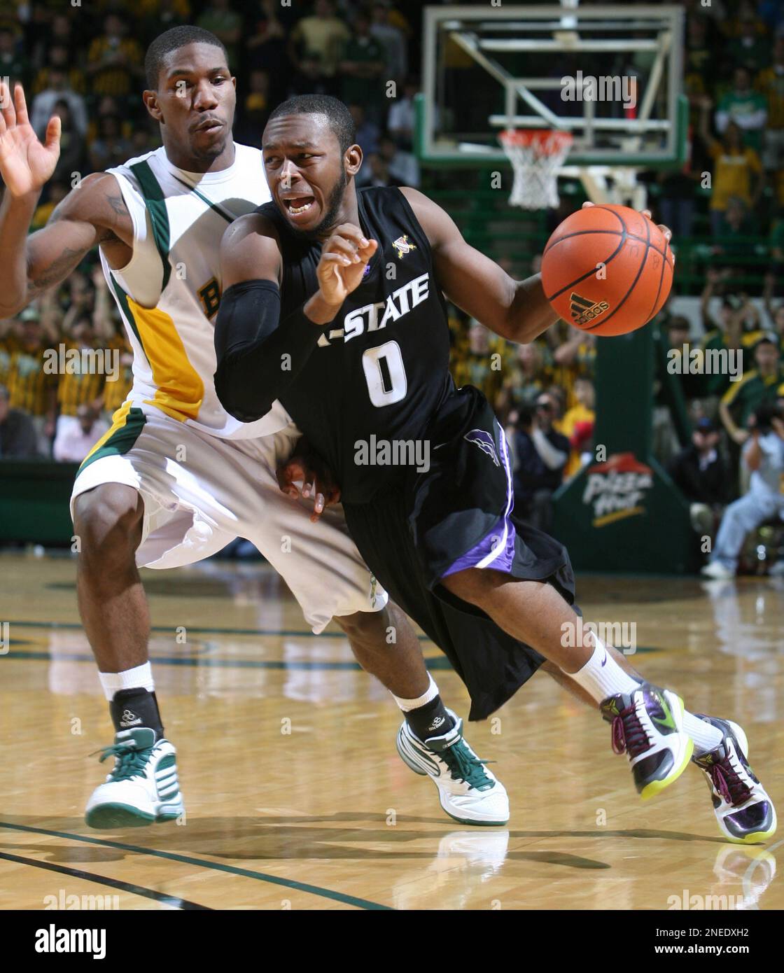 Kansas State's Jacob Pullen (0) drives by Baylor defender A.J. Walton ...
