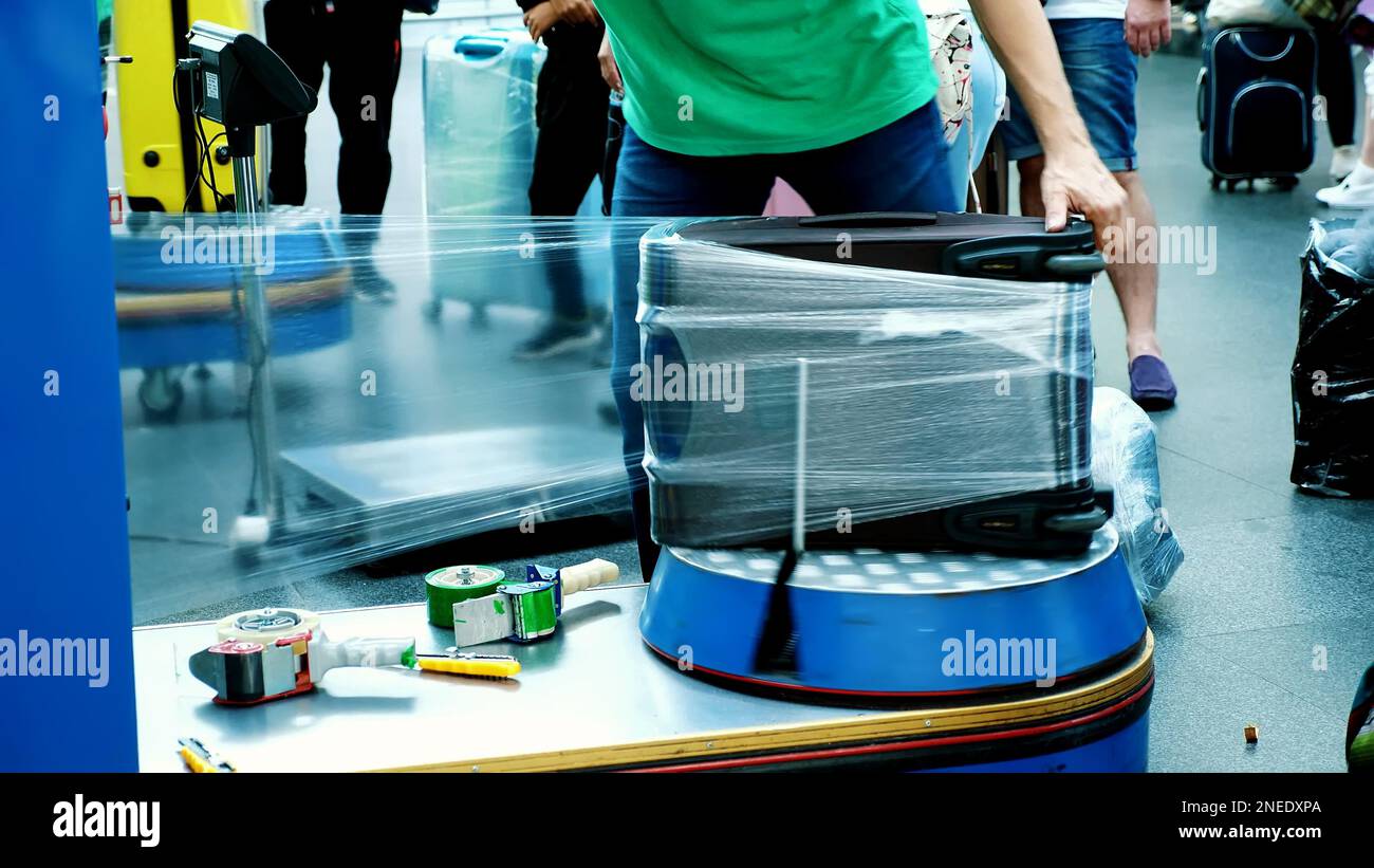 Luggage wrapping service in airport for security reason and safety ...