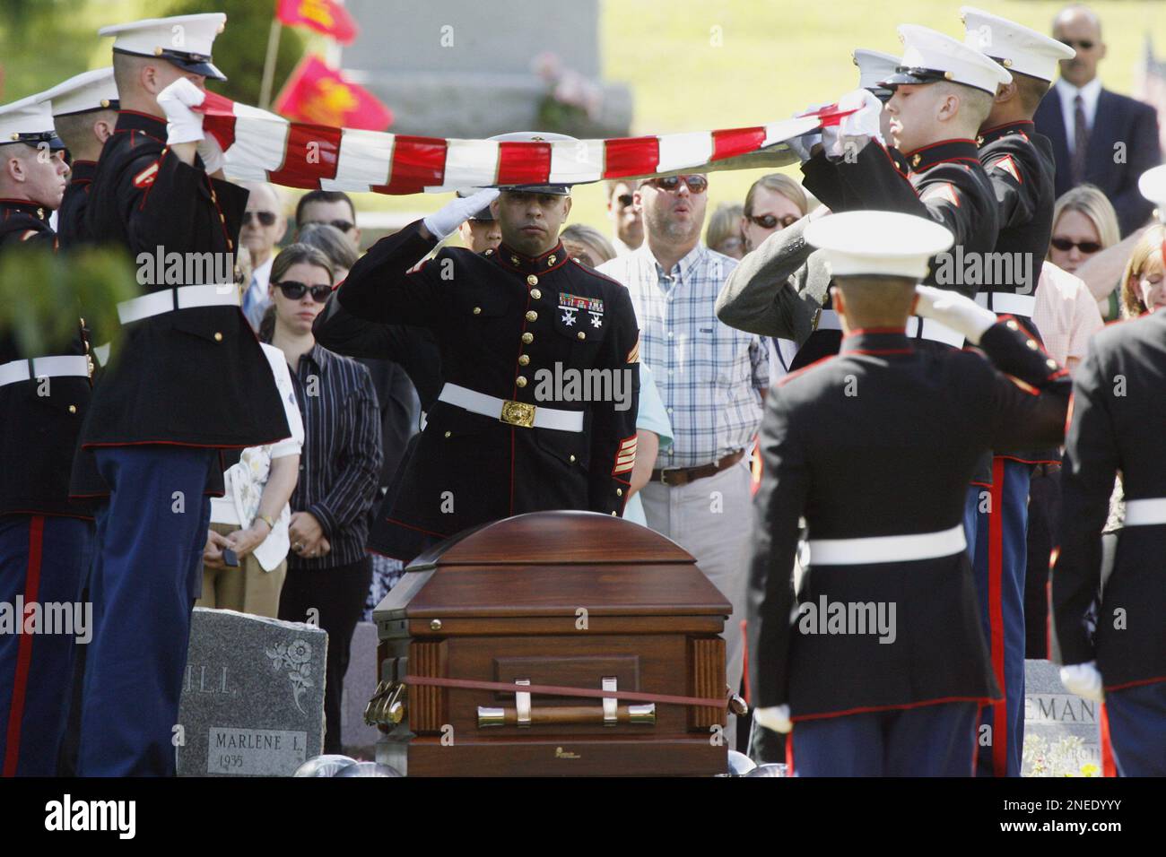 FILE-In this Aug. 11, 2006, file photo, a Marine color guard salutes at ...