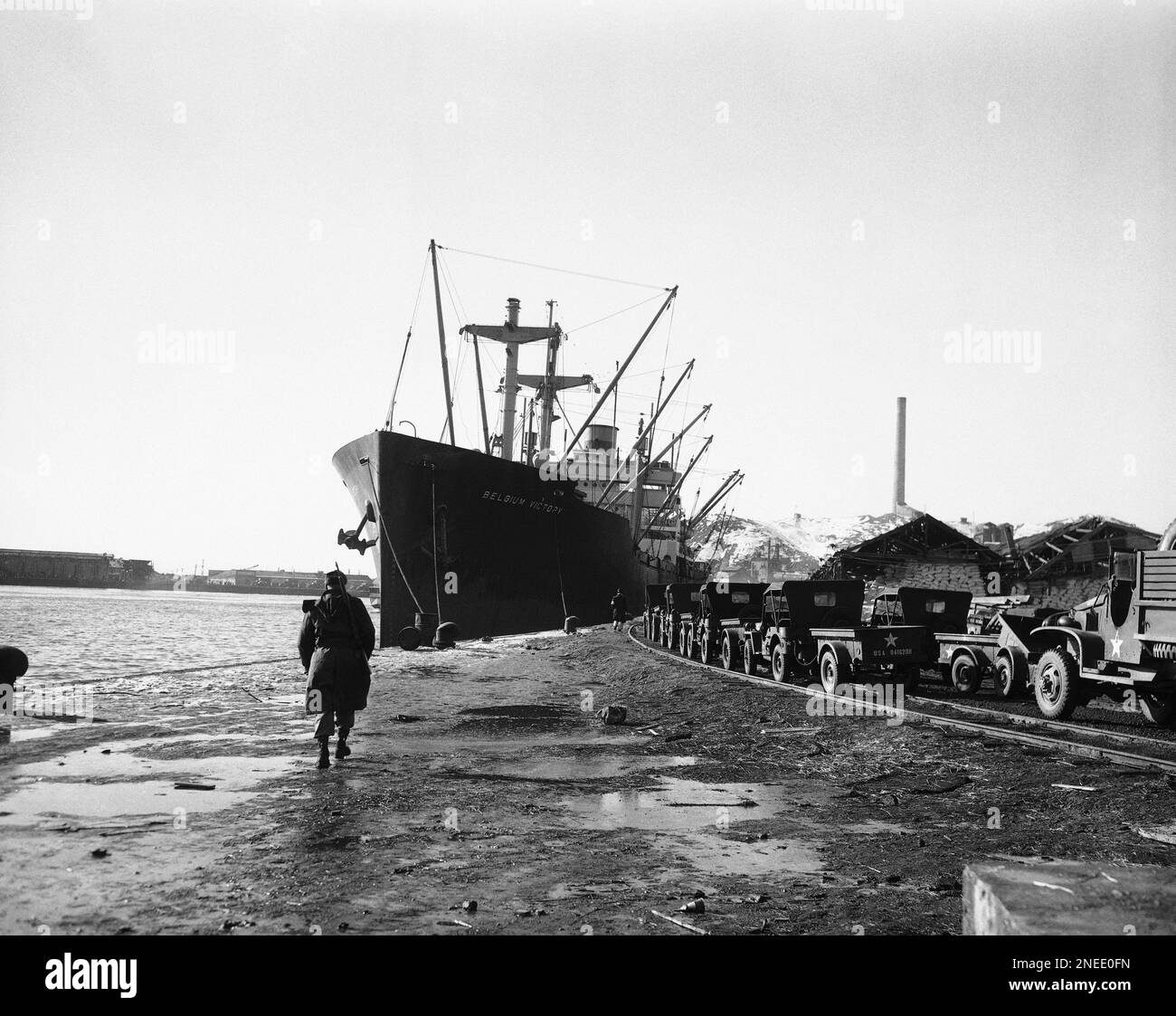 A victory ship waits at a wharf at Hungnam on Dec. 13, 1950 to load ...