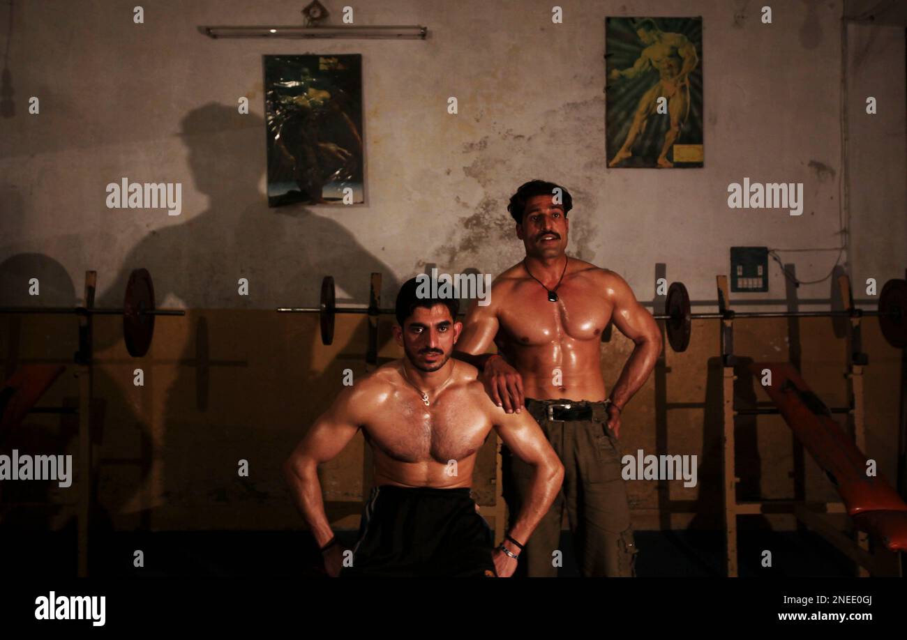 Pakistani body builders, Mohammed Israr, 20, left, and Azhar Fazal, 21 ...