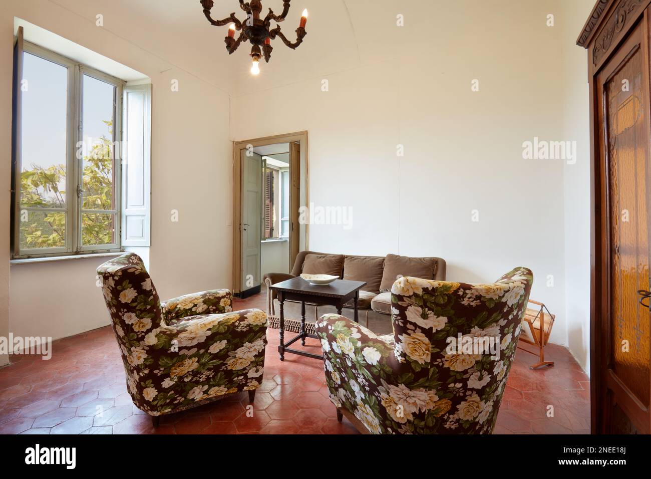 Living room in apartment interior in old country house in Italy Stock ...