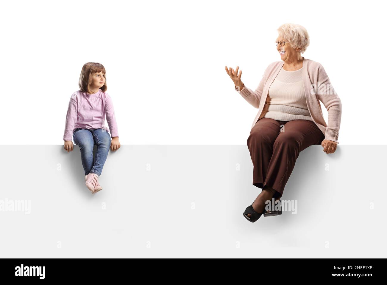 Child sitting on a blank panel and listening to grandma talking ...