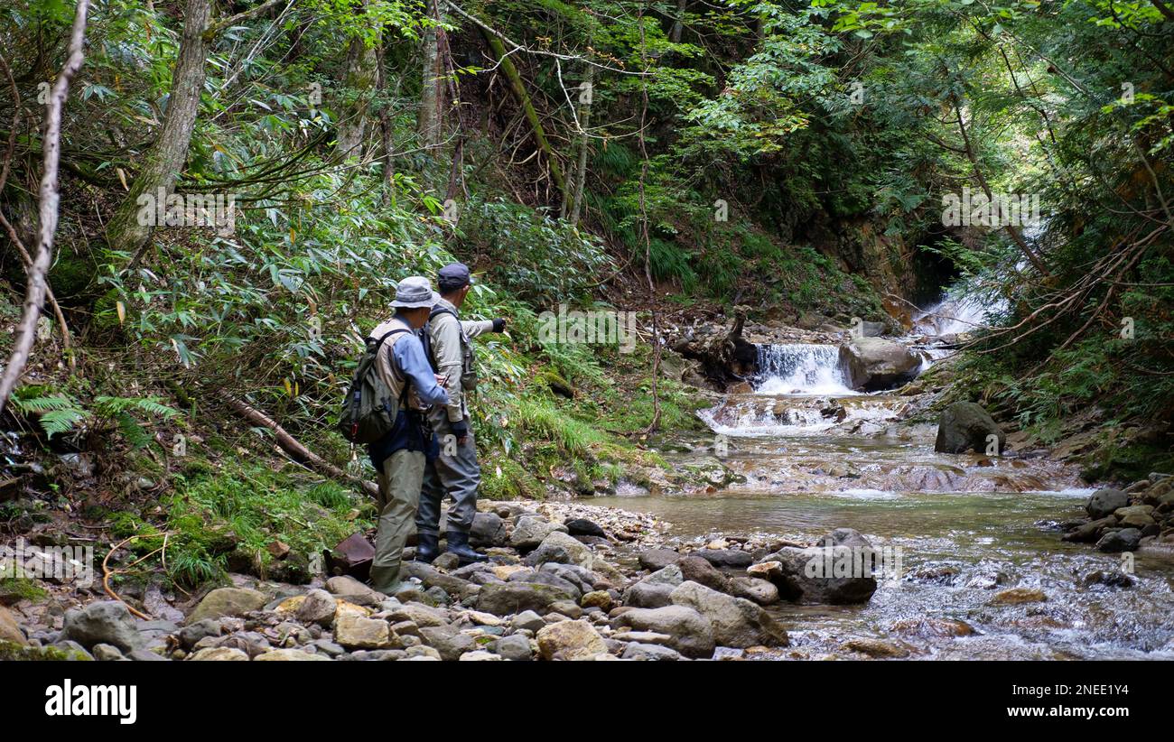 Two Japanese men on a fishing trip to Oze National Park, Gunma, Japan ...